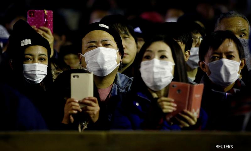 Facing uptick in virus infections, Japan moves to limit public crowds